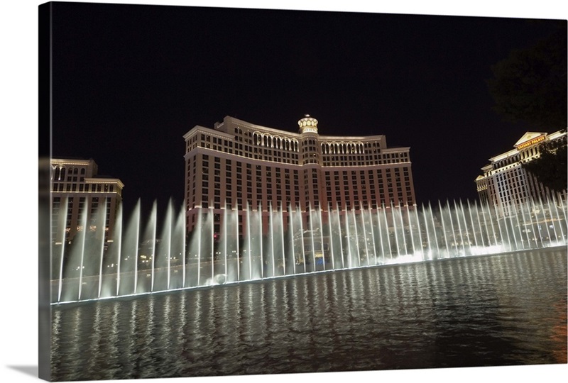 The Bellagio Hotel at night with its famous fountains, the Strip Las ...