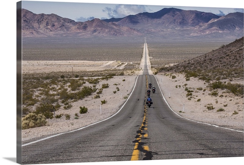 Motorcycles riding long road into Death Valley National Park | Great ...
