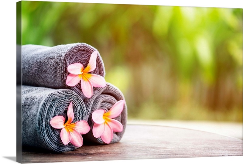 Tropical spa, beautiful fresh pink frangipani flower, outdoor setting ...