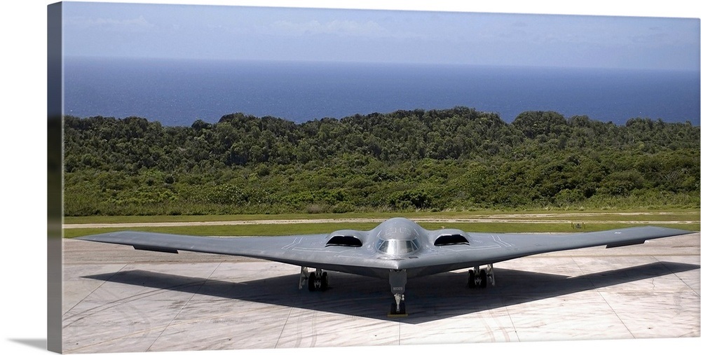 A B2 Spirit stealth bomber waits on the flightline Wall Art, Canvas ...