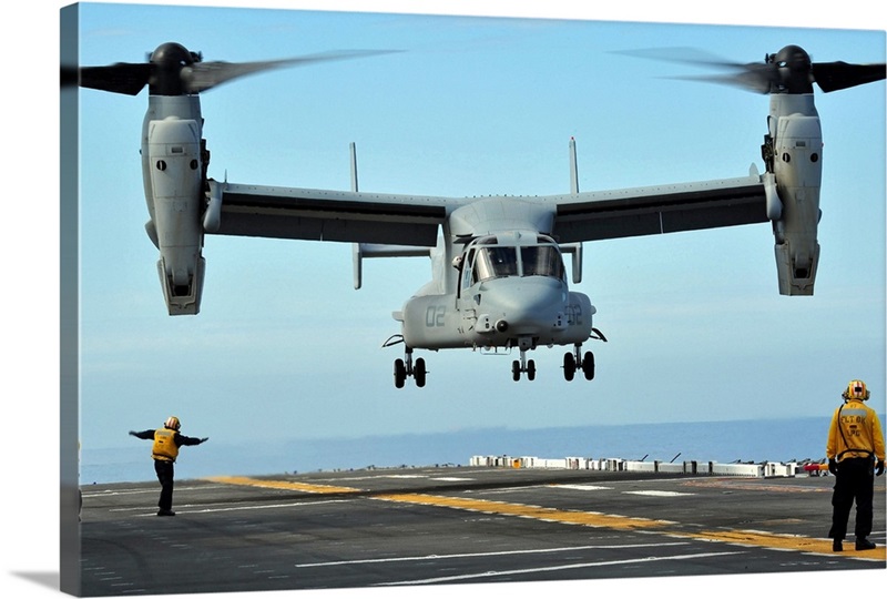A MV-22 Osprey aircraft prepares to land on the flight deck | Great Big ...