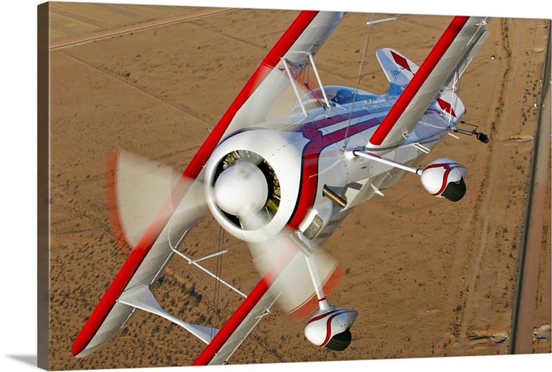 A Pitts Model 12 biplane in flight | Great Big Canvas