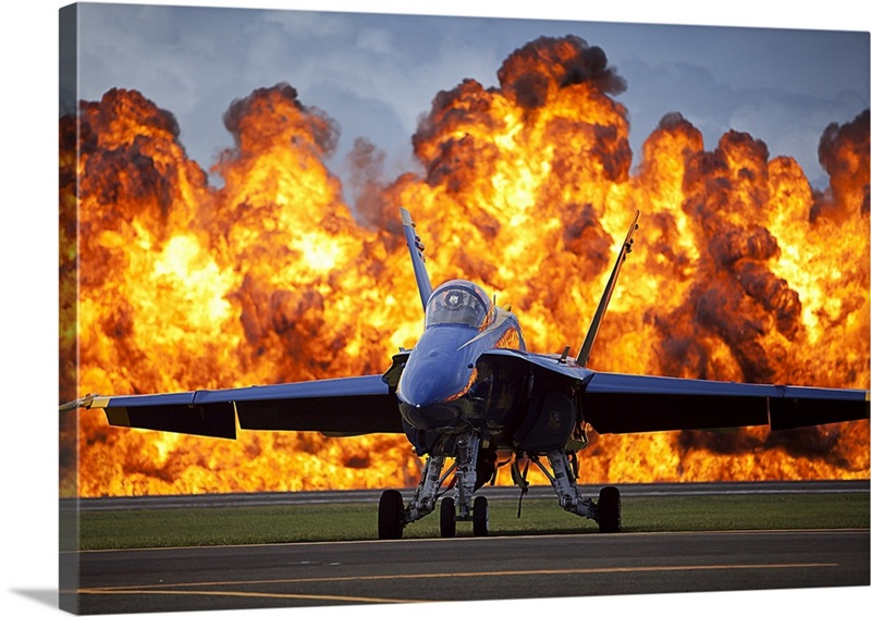 A Wall Of Fire Erupts Behind A US Navy F/A-18 Hornet Aircraft Wall Art ...