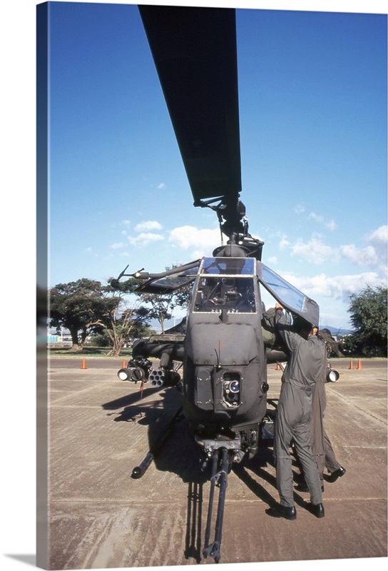 Air crewmen secure an AH1 Cobra attack helicopter | Great Big Canvas