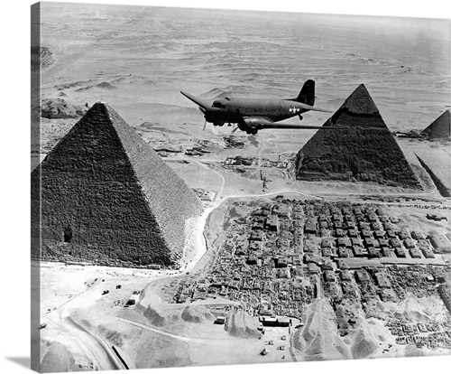 An Air Transport Command plane flies over the pyramids in Egypt, 1943 ...
