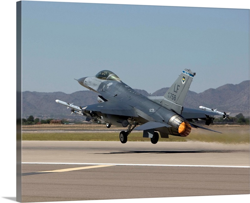 An F-16 Fighting Falcon takes off from Luke Air Force Base, Arizona ...