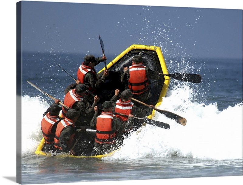 Basic Underwater Demolition/SEAL students battle through the surf ...