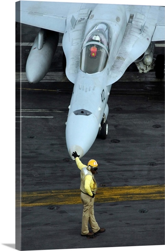 Flight Deck Officer Monitors Movement Of Flight Deck Personnel From An ...