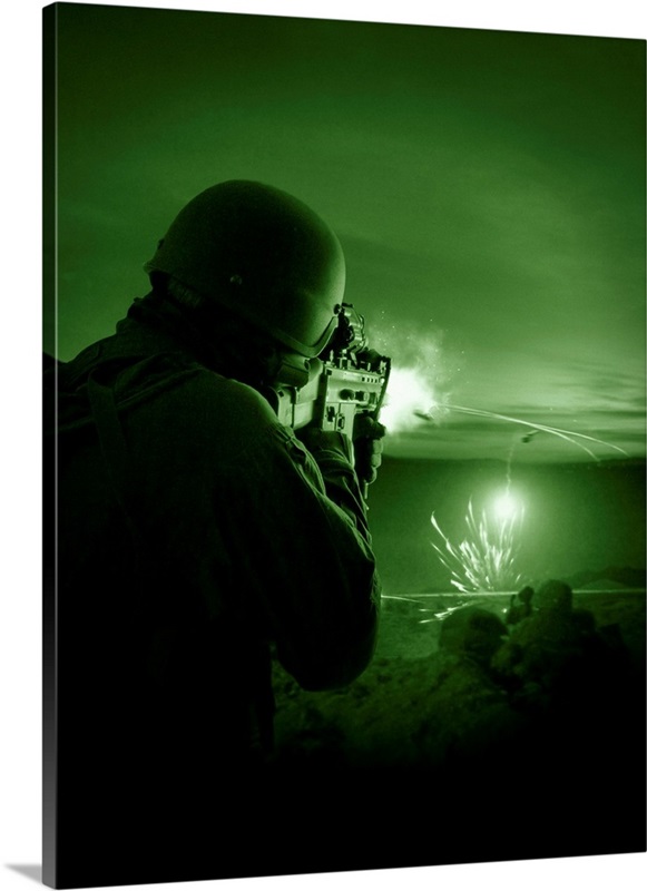 Night vision view of a special operations forces soldier firing his ...
