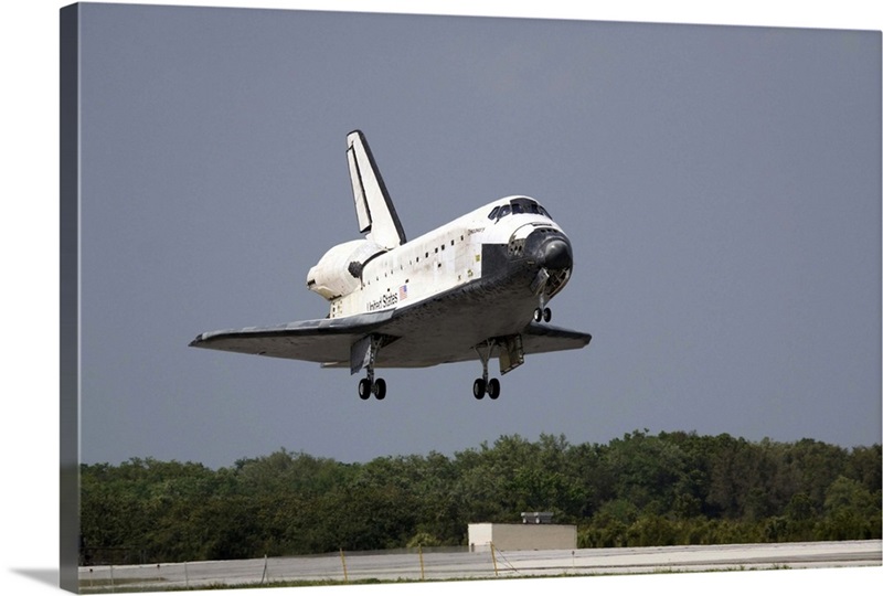 Space Shuttle Discovery approaches landing on the runway at the Kennedy ...