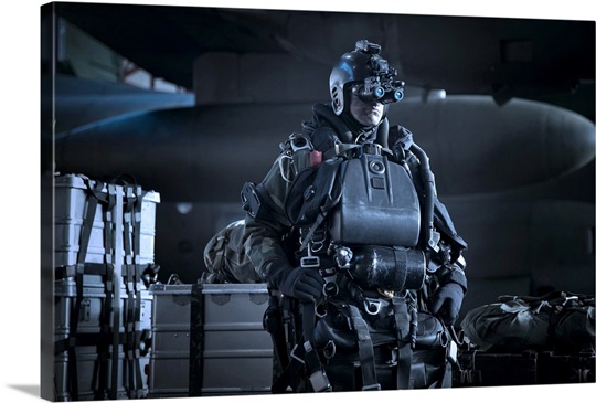 U.S. Navy Seal equipped with night vision prepares for HALO jump ...
