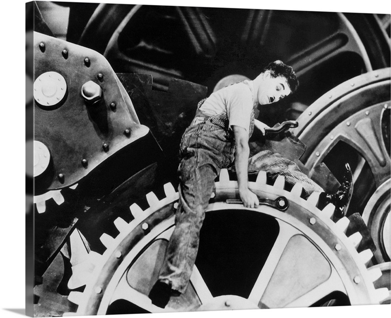 Charlie Chaplin in a scene from the film 'Modern Times,' 1936 | Great ...