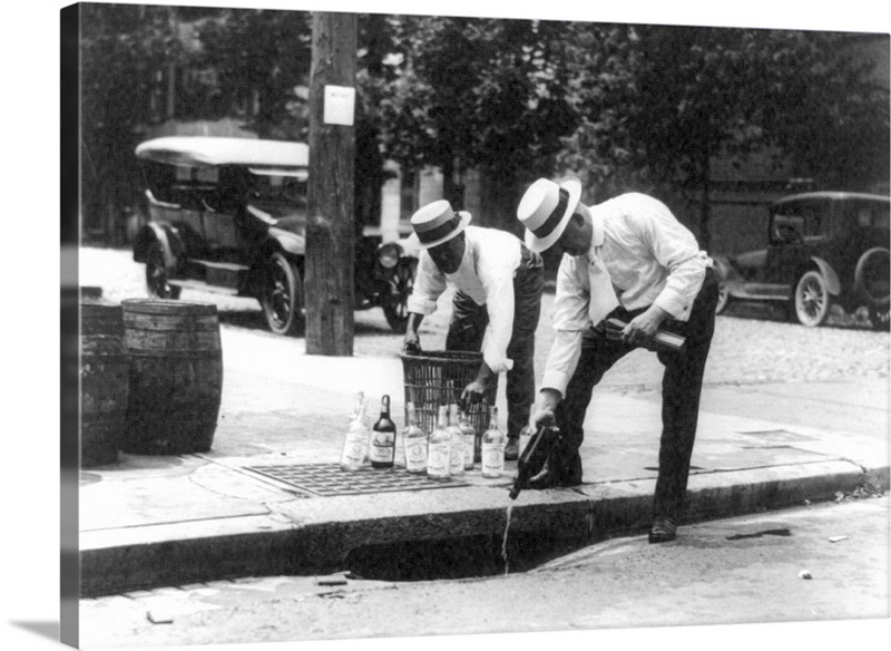 Prohibition, 1920's, Men pouring bootleg whiskey into a sewer | Great ...