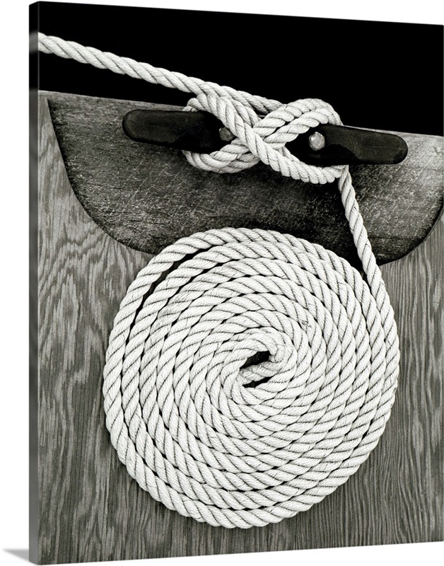A coiled rope on a dock | Great Big Canvas