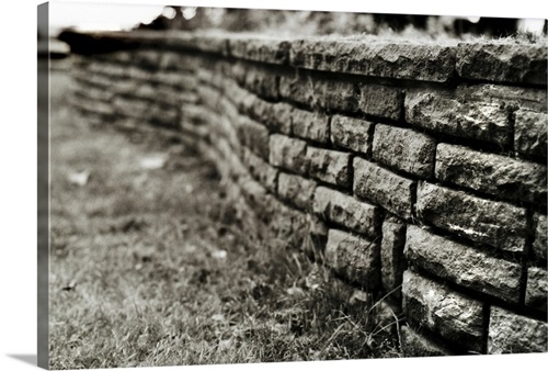 A low brick wall in a garden | Great Big Canvas