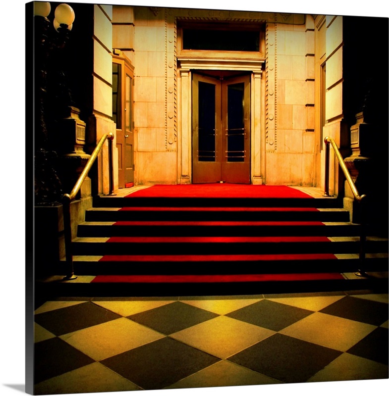 Red carpeted steps leading up into a hotel lobby | Great Big Canvas