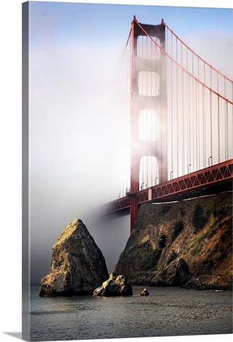 The Golden Gate bridge shrouded in mist at sunrise | Great Big Canvas