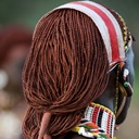Kenya, A Samburu boy and girl hold hands at a dance in their local ...
