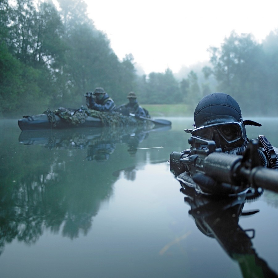 U.S. Navy SEALs combat diver prepares for HALO jump operations from a C ...